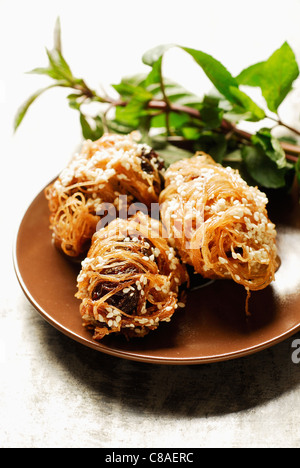 Crunchy dates with honey and sesame seeds Stock Photo - Alamy