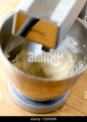 Step by step. Mixing ingredients in a standing kitchen mixer to bake ...