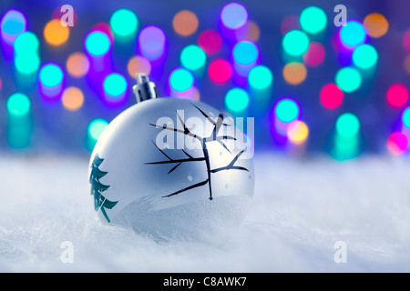 Christmas babule in silver with tree and colorful lights Stock Photo ...