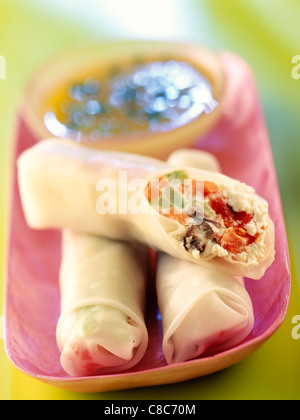 Spring vegetarian rolls food on paper plate on wooden table Stock Photo ...