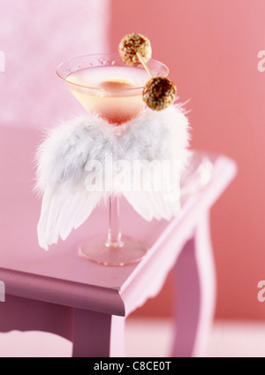 The rose exotic cocktail and fruit on blue Stock Photo - Alamy