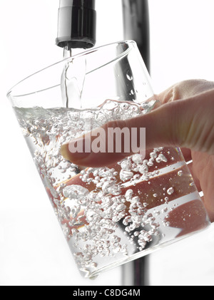 filling a glass of water from tap Stock Photo - Alamy