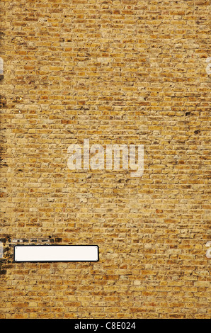 Plain Brick Wall with a Blank Street Name Sign (own text can be added ...