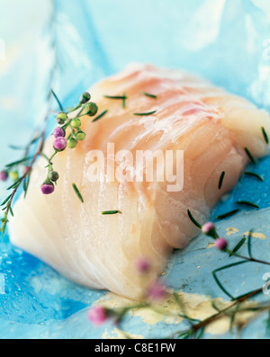 Piece of raw cod fish and rosemary isolated on white, top view Stock ...