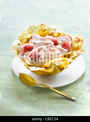 Crisp pancake tulipe filled with raspberry mousse Stock Photo - Alamy