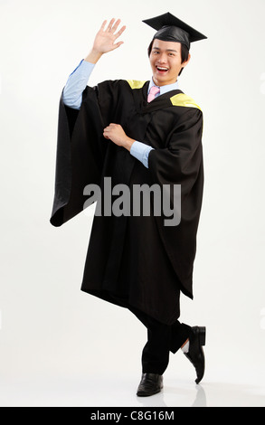 full length of the man in the graduation gown Stock Photo - Alamy