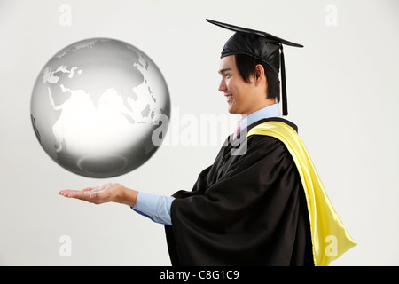 graduated student with the blobe Stock Photo - Alamy