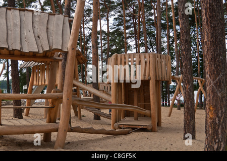 Natural wooden playground for children in the forest Stock Photo - Alamy