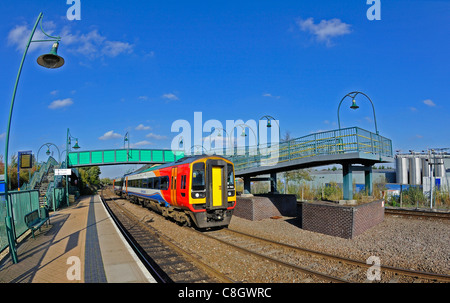 Commuter train pulling out of the local train station after a snow fall ...