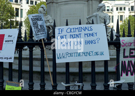 Placards with slogans and banners at the anti Capitalist protest St ...