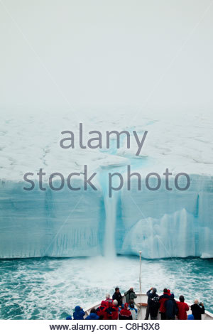 Summer meltwater forms a waterfall on an Arctic icecap Stock Photo - Alamy