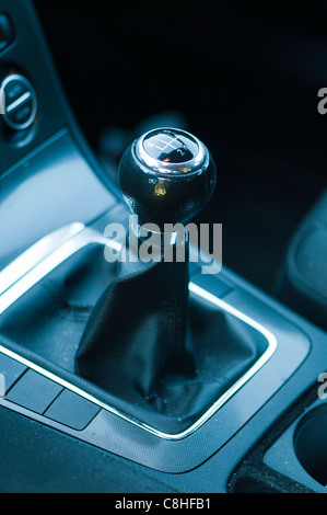 Manual gearbox handle inside the modern car. Gear shift stick close up ...