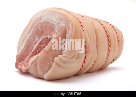 A joint of rolled belly pork trussed up with striped string Stock Photo ...