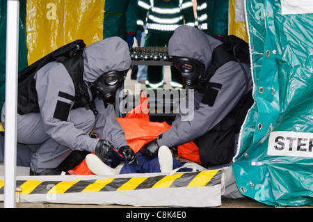 Paramedics demonstrate the decontamination procedure during the launch ...
