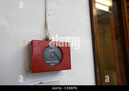 old style smash glass fire alarm button in an old factory warehouse ...