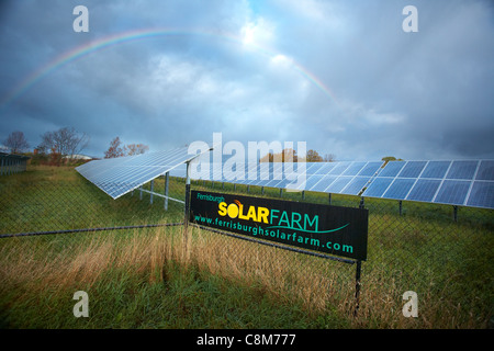 rainbow over solar electric array Stock Photo - Alamy