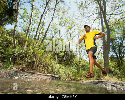 Athlete man running race. Mixed media Stock Photo - Alamy