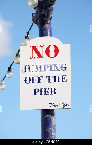No jumping off the pier signs on Eastbourne pier Stock Photo - Alamy