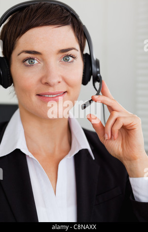 Portrait of attractive female dispatcher smiling Stock Photo - Alamy