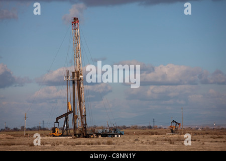Oil well servicing rig near Bakersfield, California on the floor of the ...