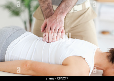 Masseur massages customer's back Stock Photo - Alamy