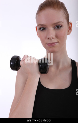 Ginger-haired girl in the gym Stock Photo - Alamy