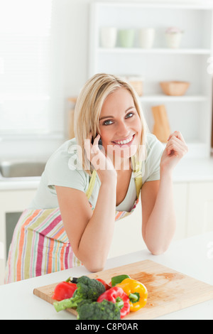 Smiling young woman looks into the camera and smiles Stock Photo - Alamy