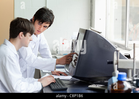 Young chemist student working in lab on chemicals Stock Photo - Alamy