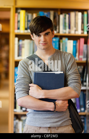 College student holding textbooks Stock Photo - Alamy