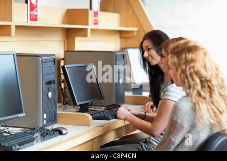 Good looking students working together Stock Photo - Alamy