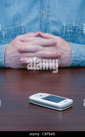 man waiting for a call on his cell Stock Photo - Alamy