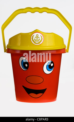 Red Plastic Bucket with Smiley Face Blue Plastic Spade and Yellow ...