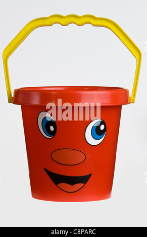 Red Plastic Bucket with Smiley Face Blue Plastic Spade and Yellow ...