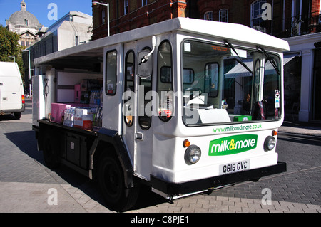 England UK Electric milk float on the cobbled street of a historic city ...