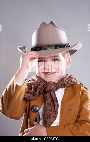 A cowboy greeting howdy with a cowboy hat nod Stock Photo - Alamy