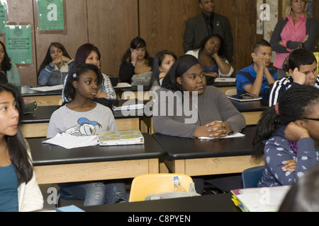 Public high school classroom overcrowded with desks, peeling paint, no ...