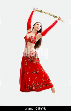 Belly dancer woman in red isolated on white Stock Photo - Alamy