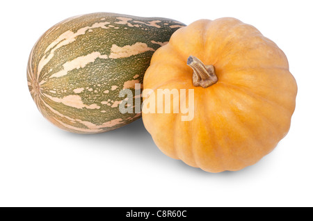 Two ripe organic pumpkins on a bamboo plate, close-up, isolated on a ...