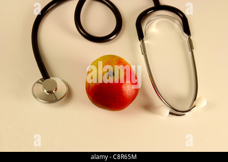 Stethoscope with apple on a table stands for healthy food 2 Stock Photo ...