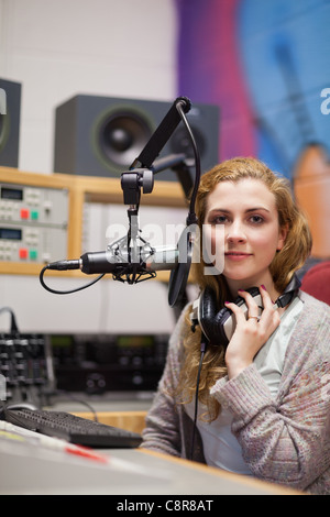 Audio engineer woman, portrait and smile by computer, mixer and pride ...
