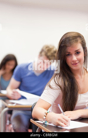Portrait of young students doing an assignment Stock Photo - Alamy