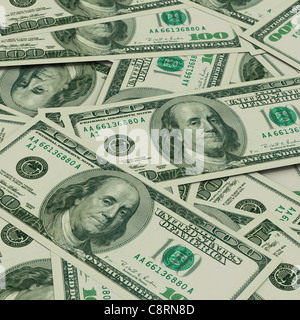 Hundred dollar notes forming an extensive background with perspective ...