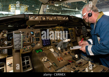 technician carrying out checks on Boeing 757 flight-deck Stock Photo ...