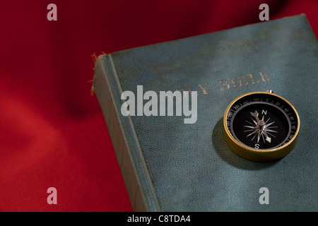 Compass on a Bible Stock Photo - Alamy