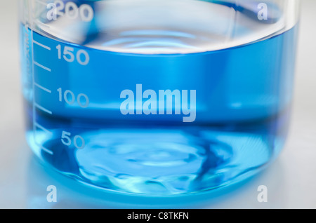 Studio shot of laboratory beaker with blue liquid Stock Photo - Alamy