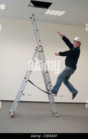 A young man falls from ladder Stock Photo - Alamy