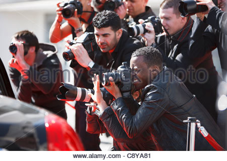 Paparazzi with camera, taking pictures Stock Photo: 111660108 - Alamy