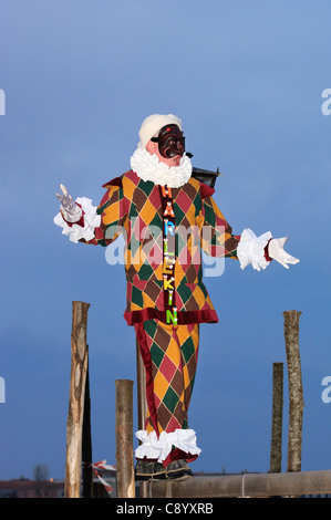 Harlequin, character of the Italian commedia dell'arte, performing at ...