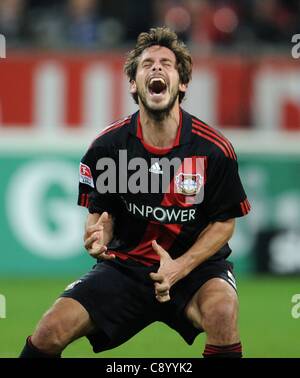 Manuel Friedrich (R) of Bayer 04 Leverkusen vies for the ball with ...