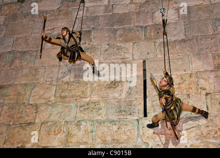 An actor dressed as knight climbing the Old City Walls during the ...